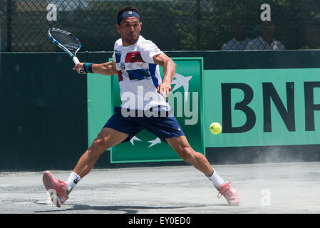 Ecuador's Emilio Gomez returns a ball to Switzerland's Henri Laaksonen ...