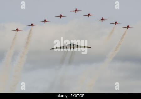Avro Vulcan bomber and Red Arrows RAF BAe Hawk aircraft in formation at RIAT 2015, Fairford, UK ...