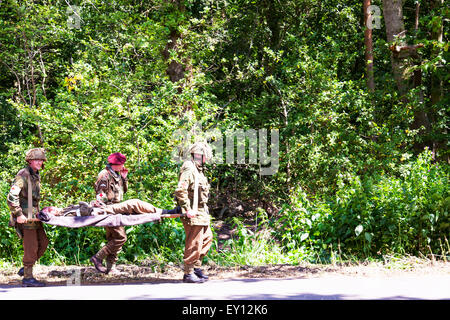Soldier carrying an injured soldier on his shoulders Stock Photo ...
