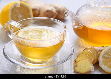Glass or cup pot with hot ginger tea on a wooden table in Mexico Stock ...