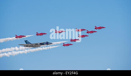 Avro Vulcan bomber and Red Arrows RAF BAe Hawk aircraft in formation at RIAT 2015, Fairford, UK ...