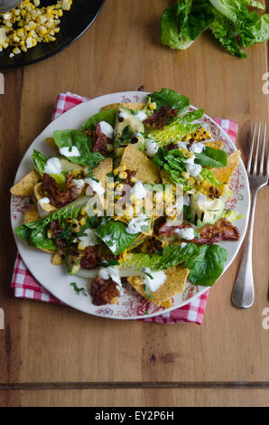 Tortilla chips with Pancetta, avocado and sweetcorn cobettes Stock ...
