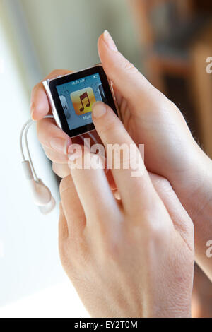 Playing Music on an iPod Nano Stock Photo - Alamy