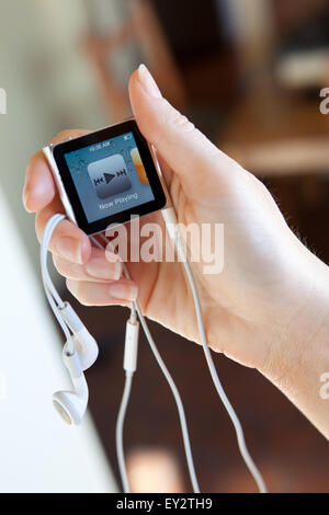 Playing Music on an iPod Nano Stock Photo - Alamy