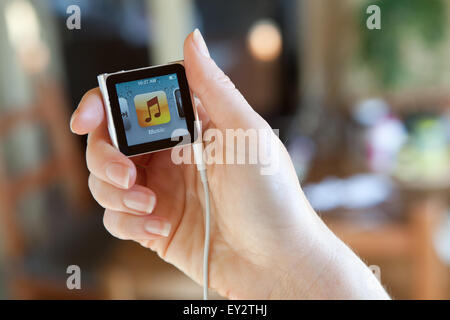 Playing Music on an iPod Nano Stock Photo - Alamy