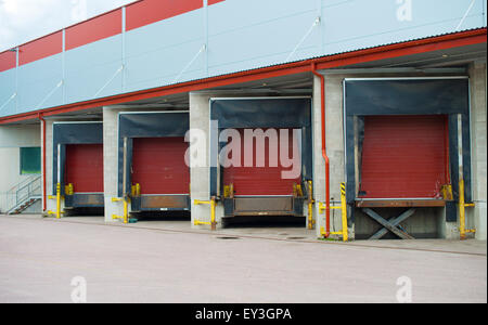 Warehouse building shipping receiving garage door and gate with road ...