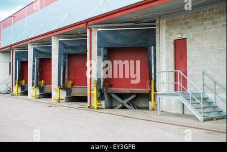 Warehouse building shipping receiving garage door and gate with road ...