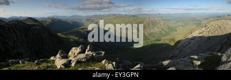 Bowfell rocky summit . Summer evening on Bowfell looking to the great ...