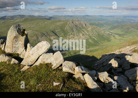 Bowfell rocky summit . Summer evening on Bowfell looking to the great ...