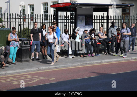 Bus stop queue Stock Photo - Alamy