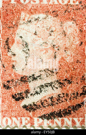 Close up of 1d red Victorian British Postal stamp on black background ...