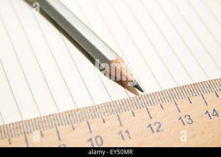 Notepad with a recording sheet, pencil and wooden ruler Stock Photo - Alamy