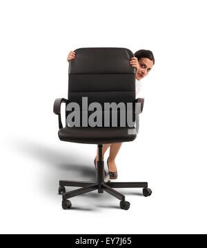 Scared Woman Hiding Behind Chair And Under Desk Stock Photo - Alamy