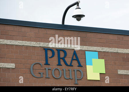 A logo sign outside of the headquarters of the PRA Group, Inc., also ...