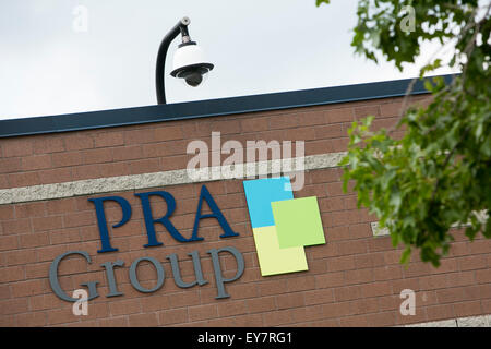 A logo sign outside of the headquarters of the PRA Group, Inc., also ...