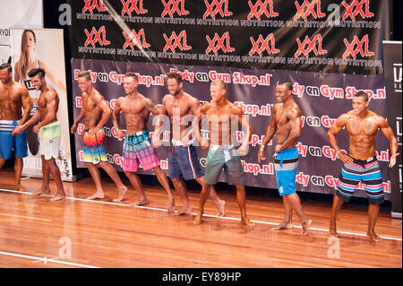 Male fitness contestants showing their best in a lineup comparison at ...