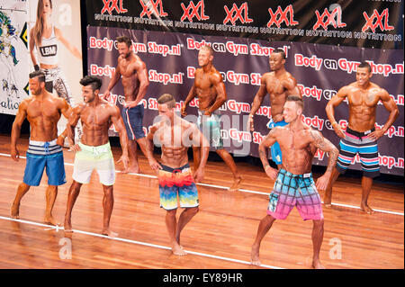 Male fitness contestants showing their best in a lineup at the 38th ...