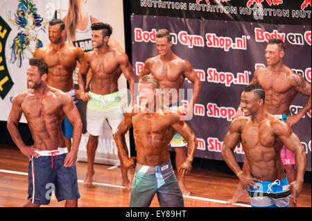 Male fitness contestants showing their best in a lineup comparison at ...