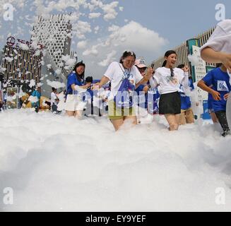 Yantai, China's Shandong Province. 25th Nov, 2015. People walk in snow ...