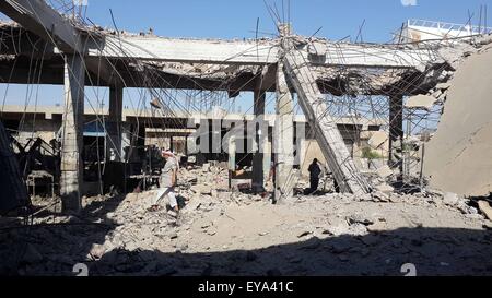 A man walks near a destroyed building in the eastern Ghouta of Damascus ...