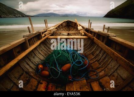 Currachs, traditional Irish fishing boats, lying upturned on Inisheer ...