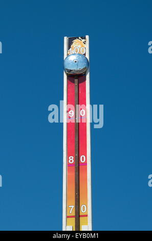 Carnival game of hit the bell Stock Photo - Alamy