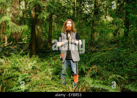 A hippy man meditating in the forest Stock Photo - Alamy