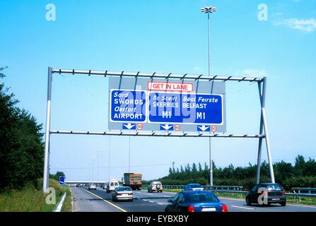 M1 Motorway, Co Dublin, Ireland; Car Driving By A Sign Stock Photo - Alamy