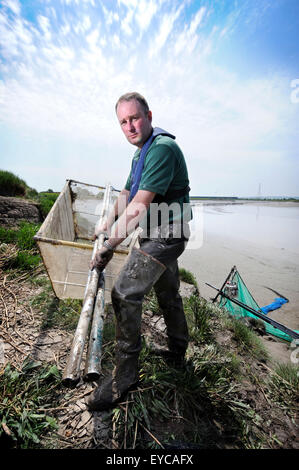 A confiscated oversized elver net and an illegal flow net (behind) on ...