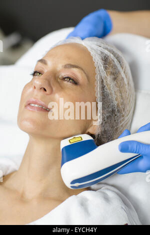 Woman receiving a beauty treatment Stock Photo - Alamy