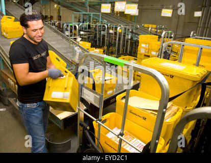 Interior view of the parcel center, parcels on the conveyor belt ...