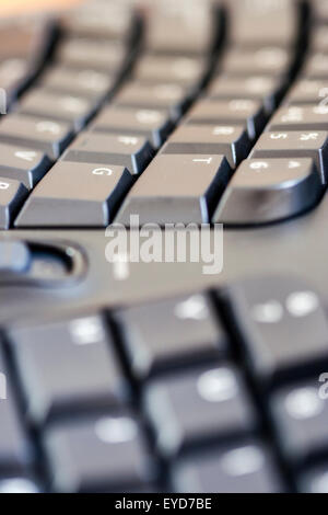 View along dark grey computer keyboard input device. Showing various ...