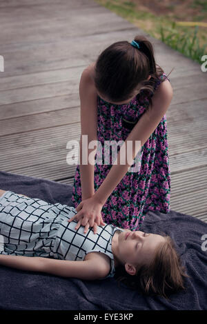 Children practising CPR first aid - chest compressions Stock Photo - Alamy