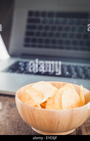 Crispy potato chips on work station, stock photo Stock Photo - Alamy