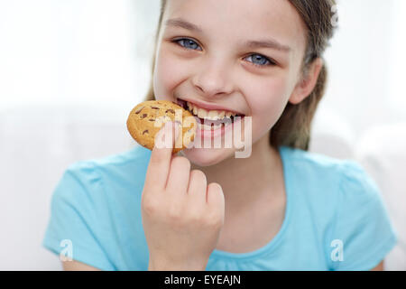 Child teen girl with dessert bakery. Teenager kid hold french macaron ...