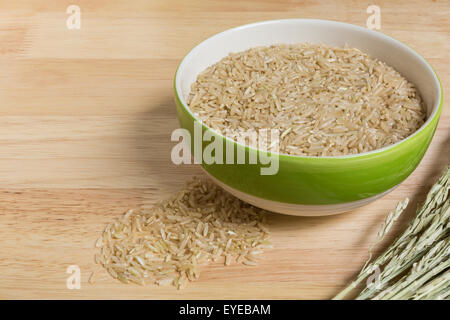 Brown Rice in a Wood Bowl on White Stock Photo - Alamy