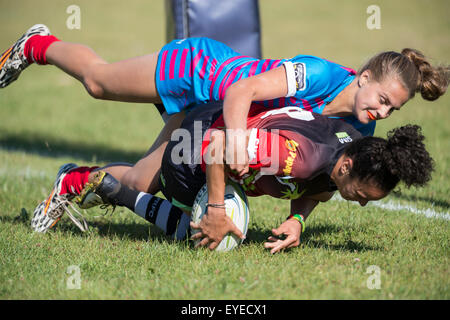 Rugby player making diving tackle Stock Photo - Alamy
