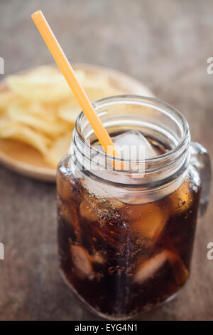 Iced cola with potato chips, stock photo Stock Photo - Alamy