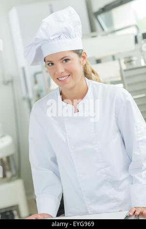 Female baker proud of her cake Stock Photo - Alamy