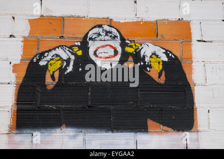 Example of urban street art - graffiti image of a chimp using spray ...