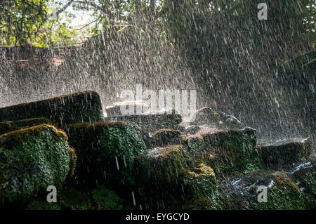 Heavy rain bouncing off rocks at Lumsdale Fall in Derbyshire, Peak ...