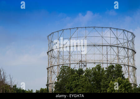 old disused gasometer metal covered with vegetation Stock Photo - Alamy