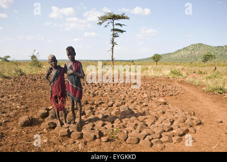 Ethiopia, Omo Valley, Southern Mursiland, Portrait of Three Mursi boys ...