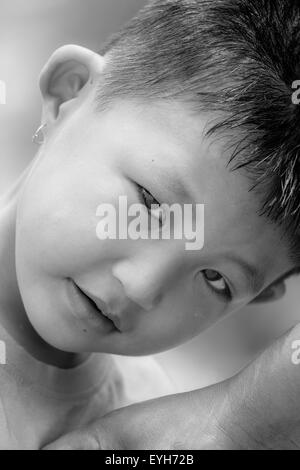 Black and white Portrait of a little mongoloid boy happy and smiling ...
