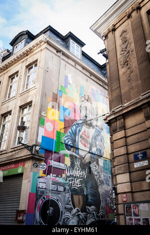 Manneken Peace mural in Brussels Stock Photo - Alamy