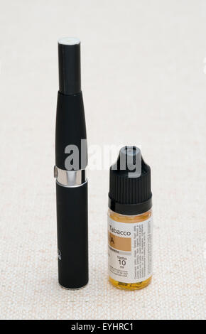 Electronic cigarette with smoking liquid bottle on white background ...