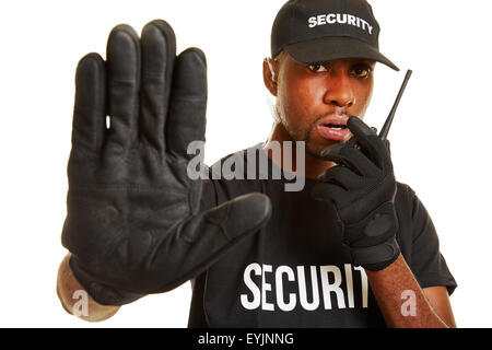 African bodyguard from personal security in a suit with a radio set ...