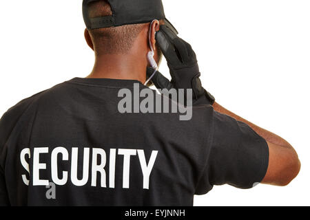 African bodyguard from personal security in a suit with a radio set ...