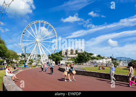 Torquay, UK. People walking on the beach at Torquay and Paington with ...