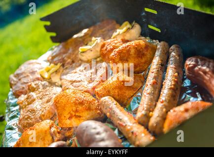 meat with herbs grilling on barbecue Stock Photo - Alamy